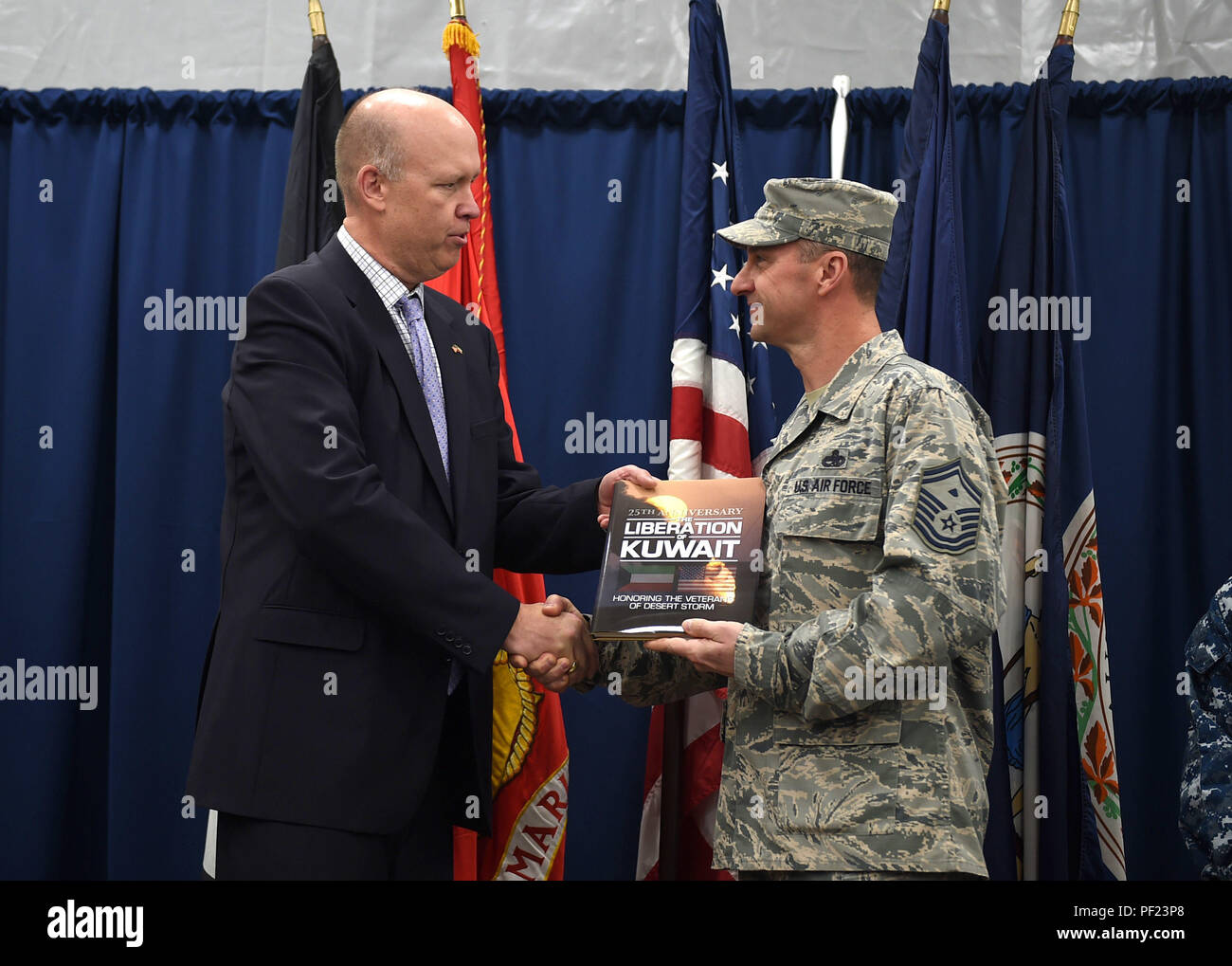 Gulf War veteran Senior Master Sgt. Charles Witt receives a book ...