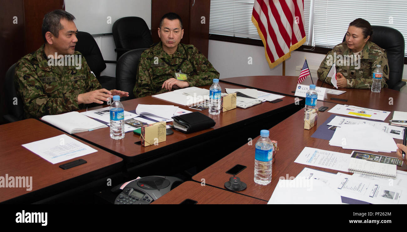 Japan Ground Self-Defense Force (JGSDF) Maj. Noriyoshi Matsuguma (left ...