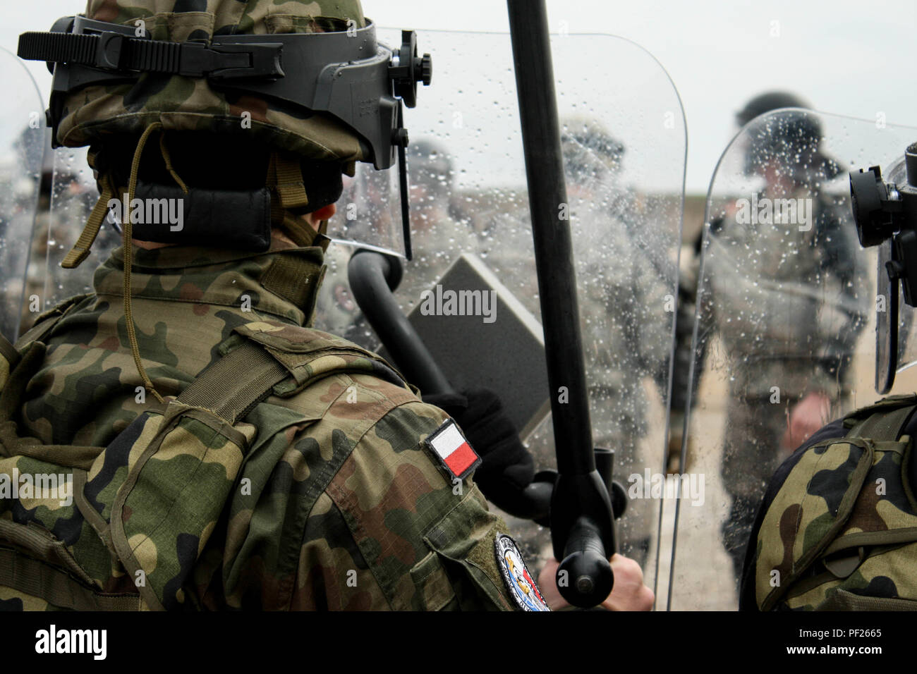 Polish soldiers assigned to Multinational Battle Group-East maintain a ...