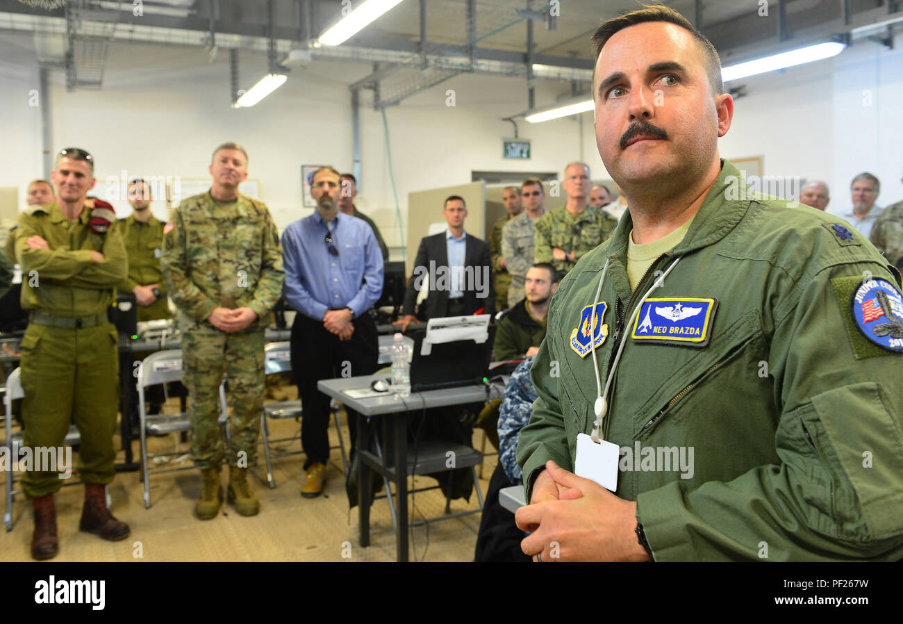 U.S. Air Force Lt. Col. Michael Brazda gives a briefing to Israeli Maj ...
