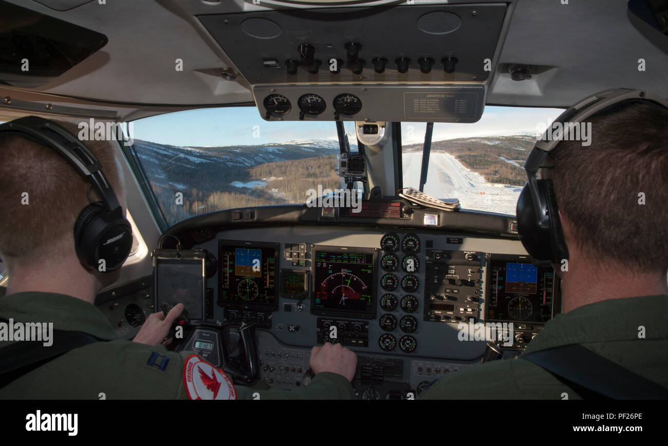 Air Force Lt. Col. Blake Johnson (right) guides Capt. David Blessinger ...