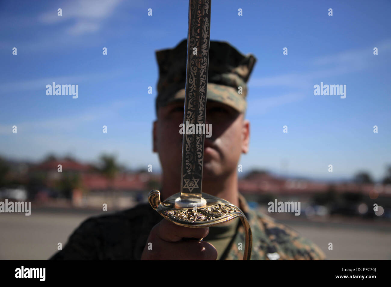 A U.S. Marine practices proper sword manual during Corporals Course on ...