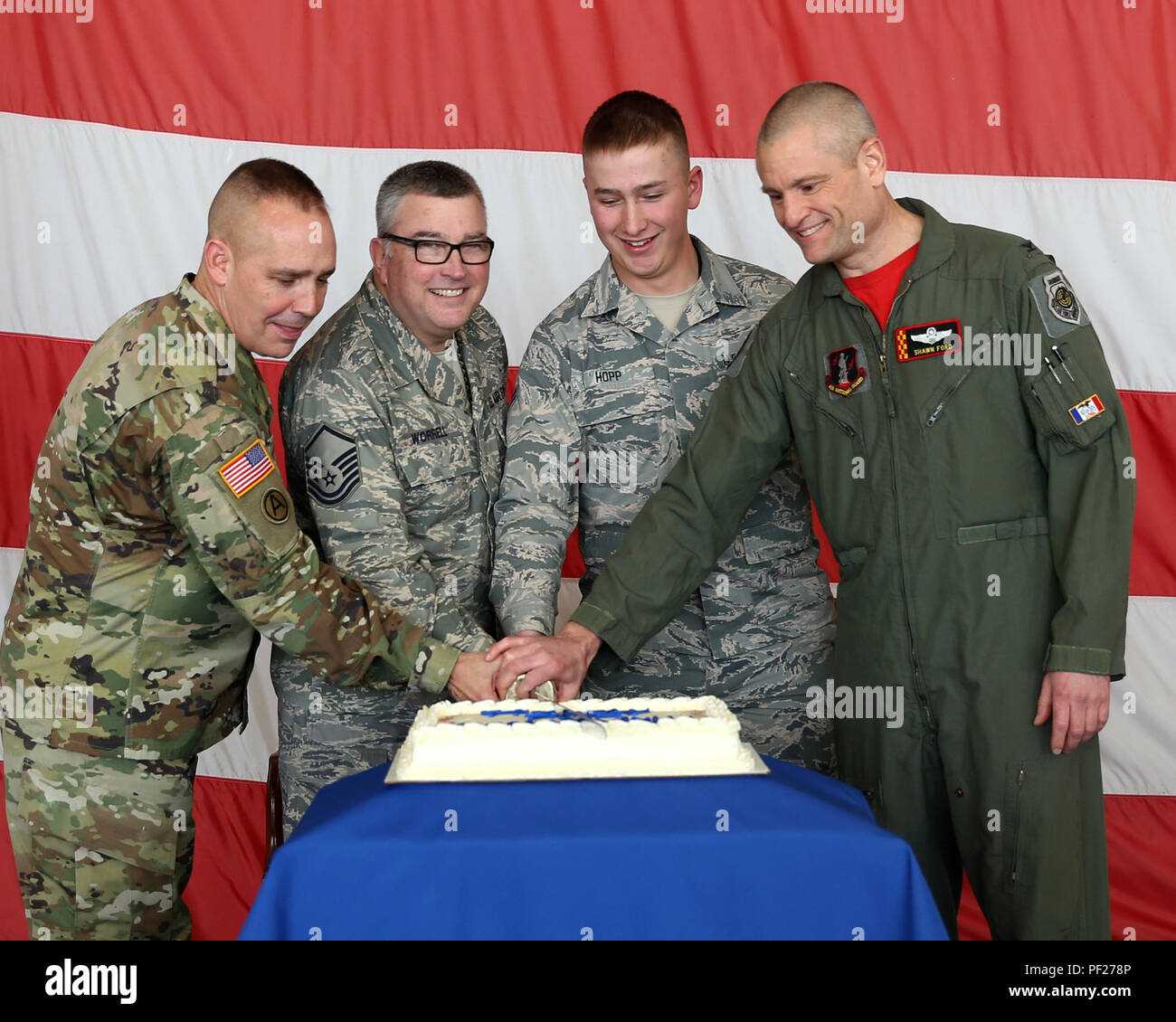 Cutting the cake at the 75th anniversary of the 132nd Wing are (from ...