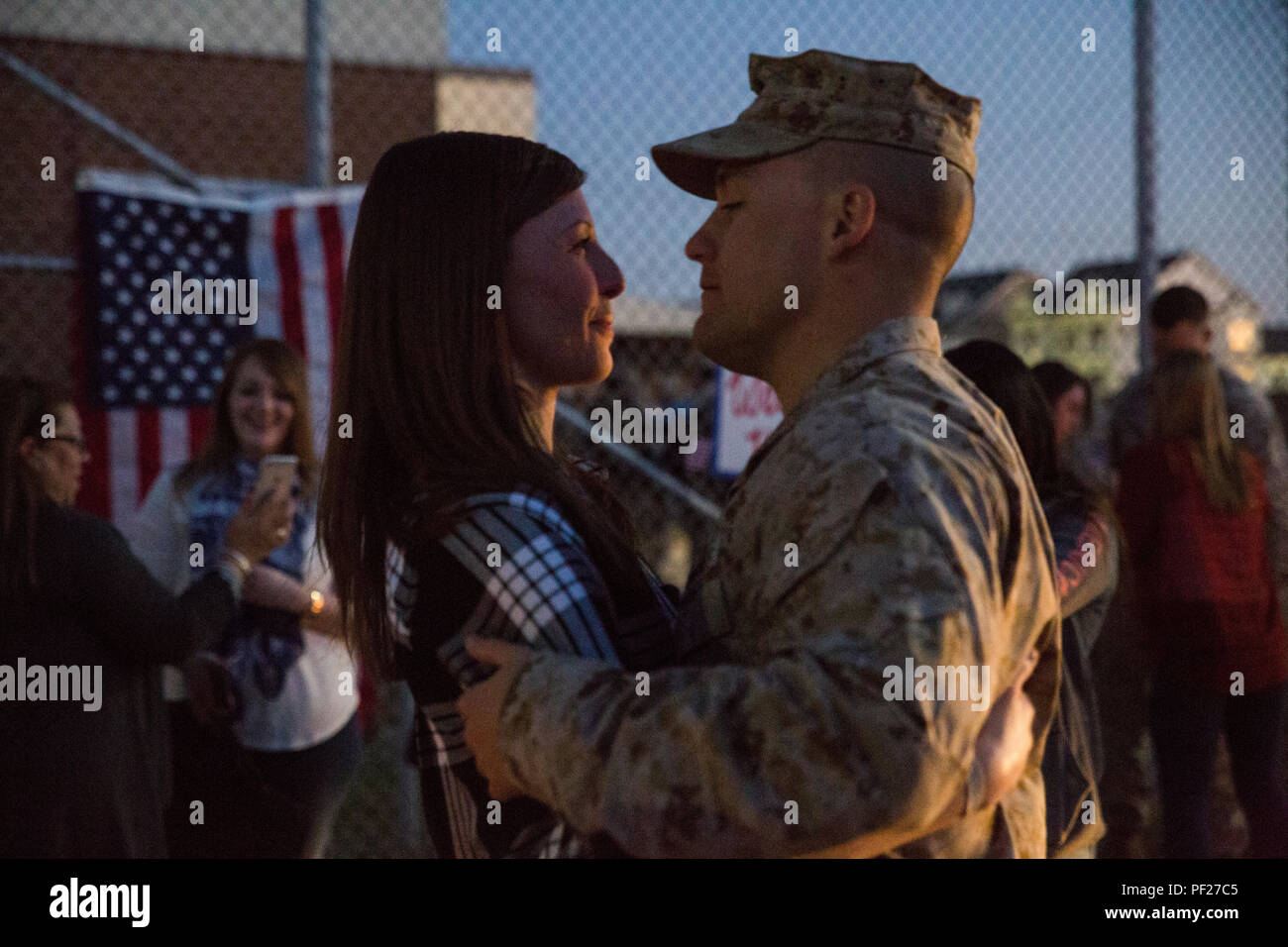 Marine Capt. Todd Sturgill embraces his wife, Feb. 29, after spending ...