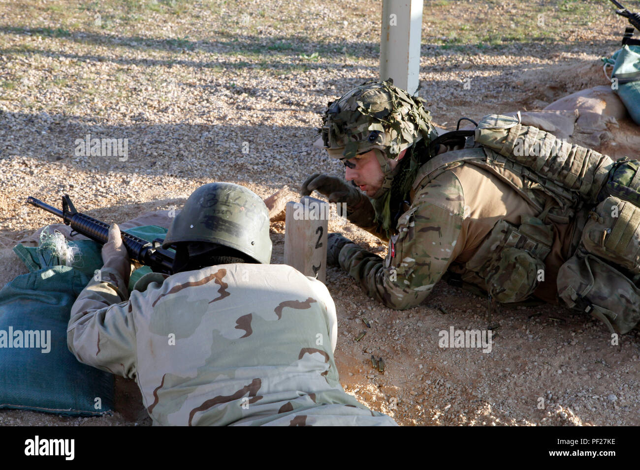 A Danish soldier with Task Force Al Asad coaches an Iraqi Soldier from ...