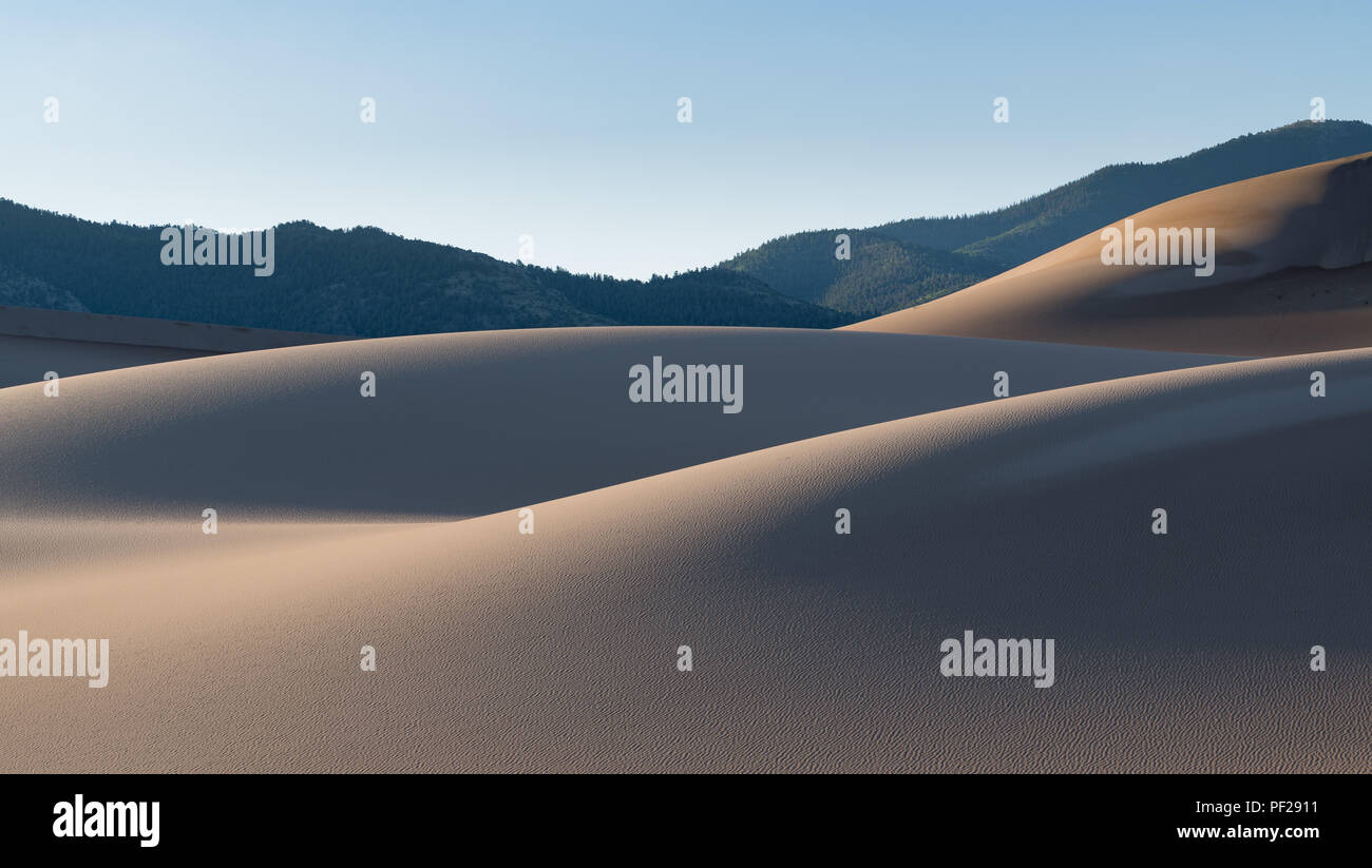 Sun rising on the sand dunes at great sand dunes national park Stock ...