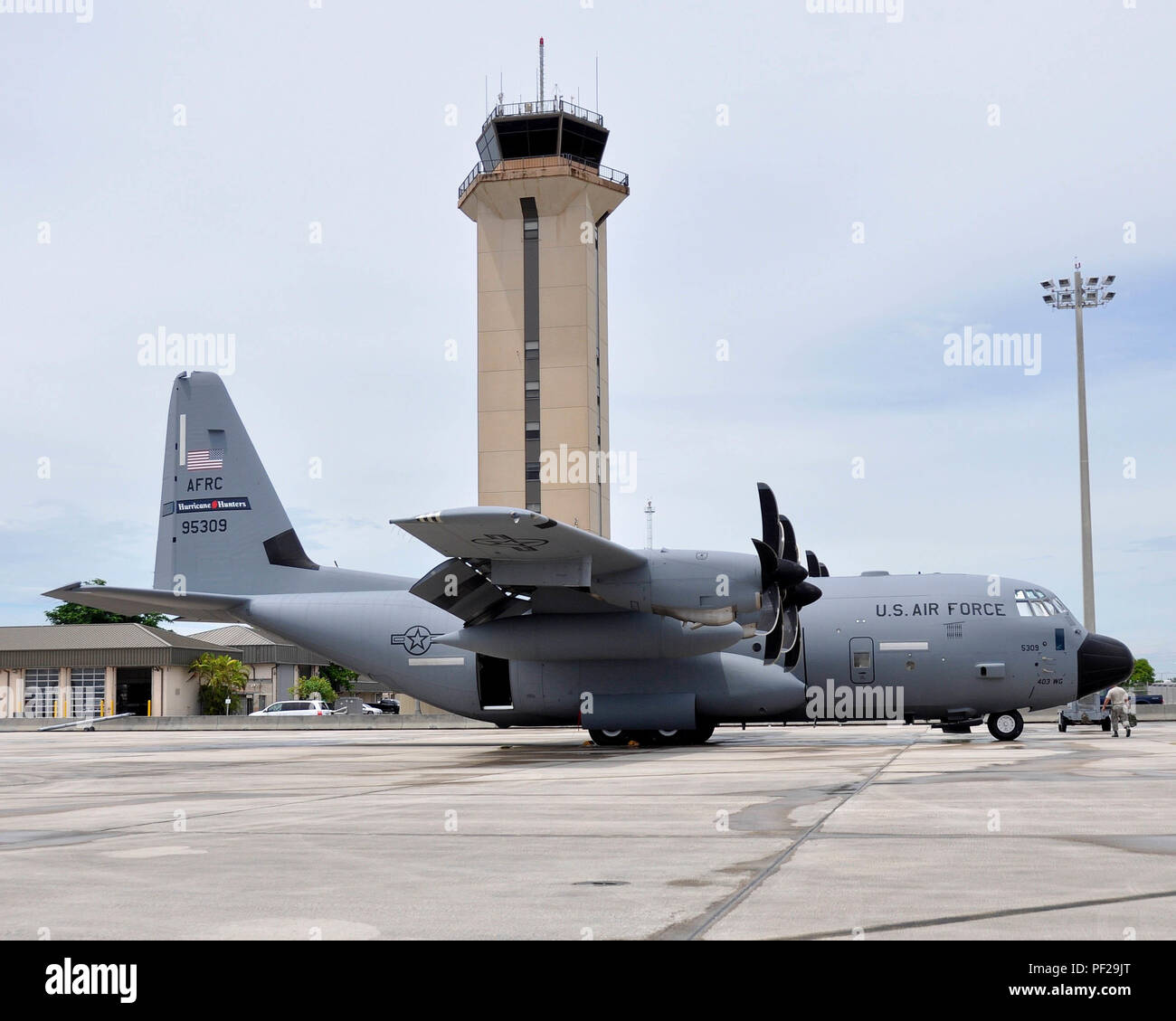 A WC-130J Hurricane Hunter aircraft sits on the flightline at Homestead ...