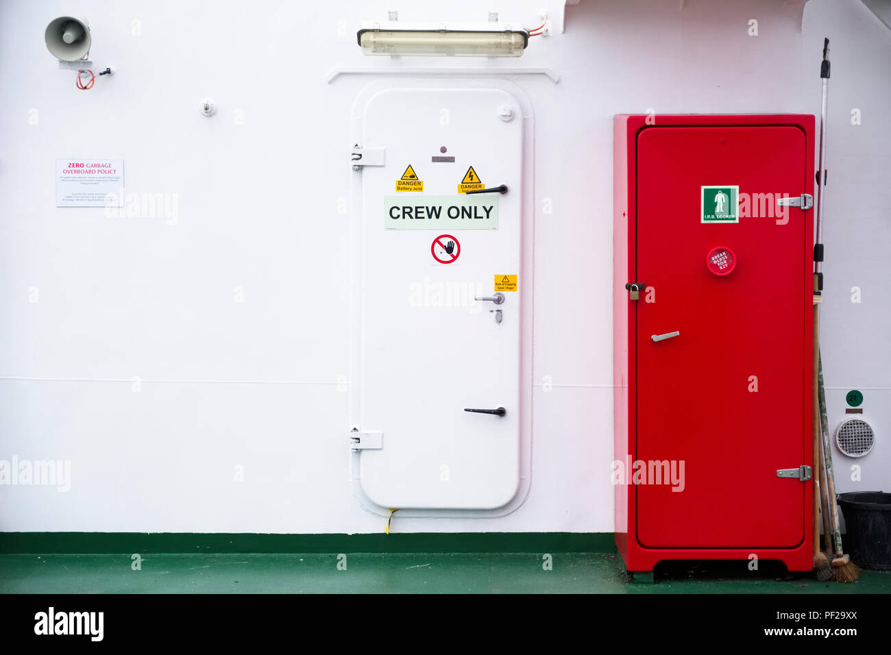 Crew only sign on white door onboard ferry cruise ship Stock Photo - Alamy