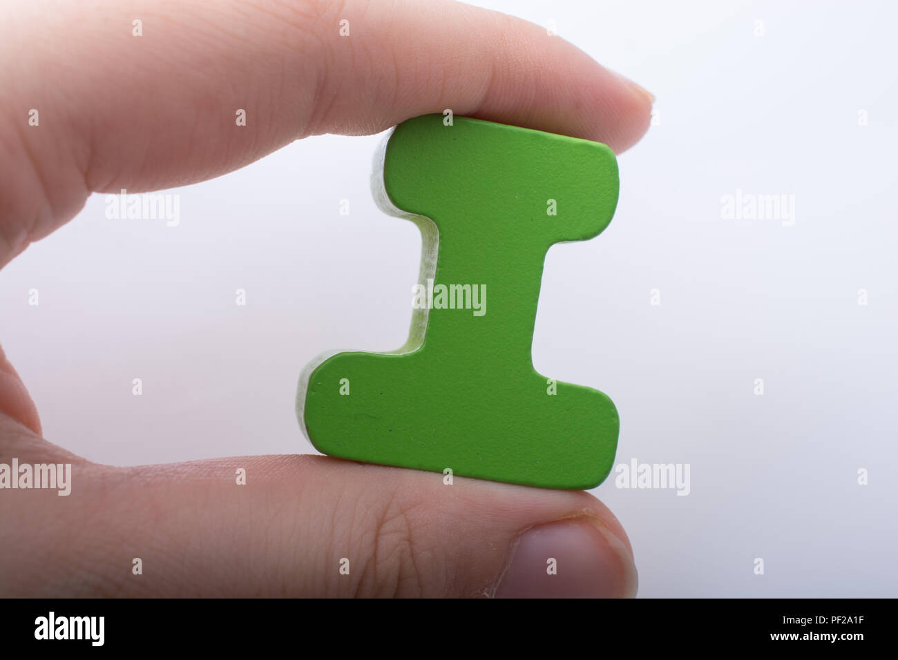 Hand holding Letter cube of I of Alphabet Stock Photo - Alamy