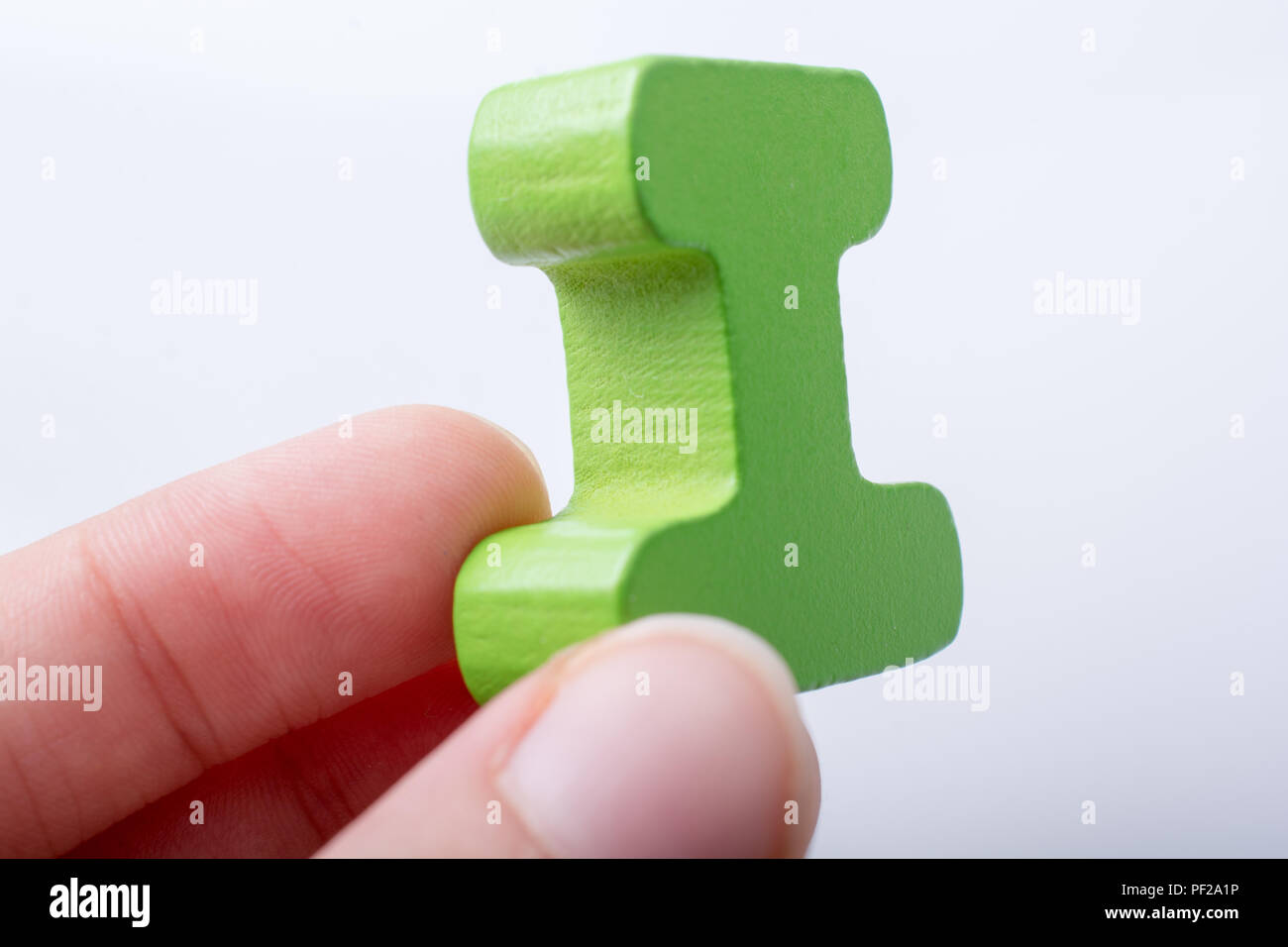 Hand holding Letter cube of I of Alphabet Stock Photo - Alamy