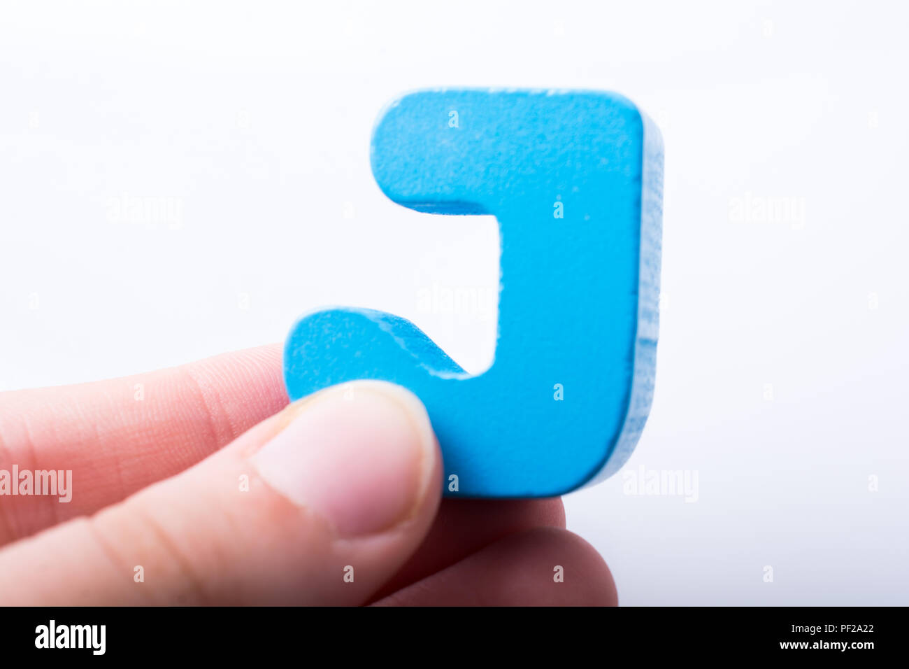 Hand holding Letter cube J of Alphabet Stock Photo - Alamy