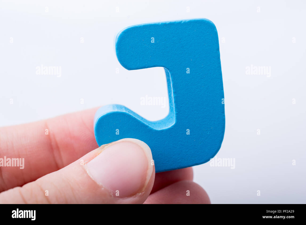 Hand holding Letter cube J of Alphabet Stock Photo - Alamy
