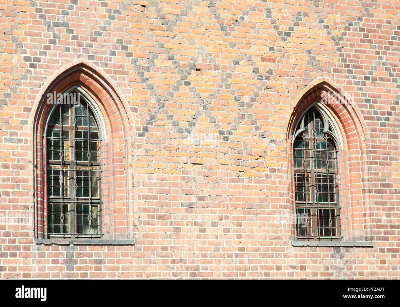 The view of castle windows with characteristic medieval brick pattern ...