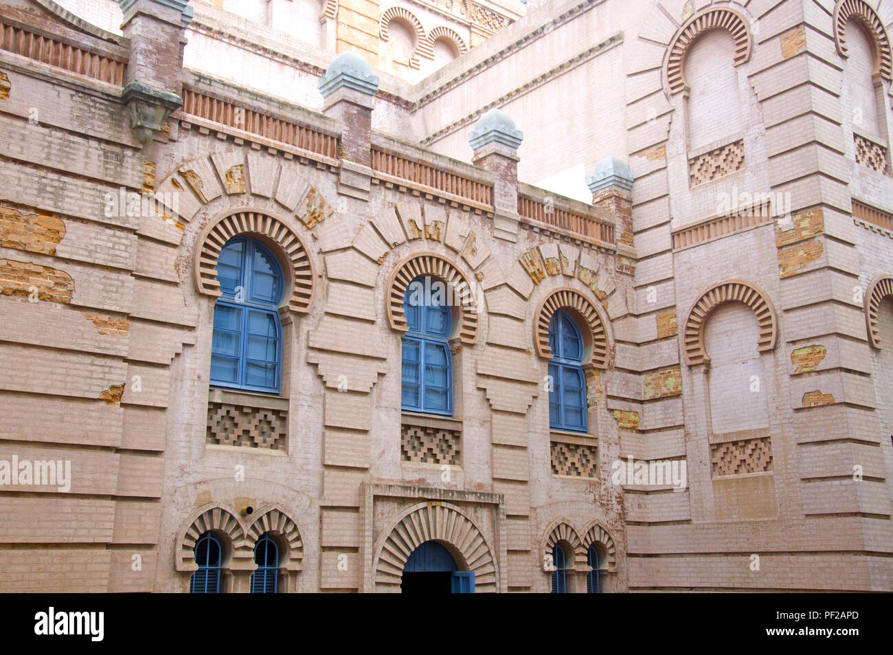Old cathedral wall with blue windows, Spain Stock Photo - Alamy