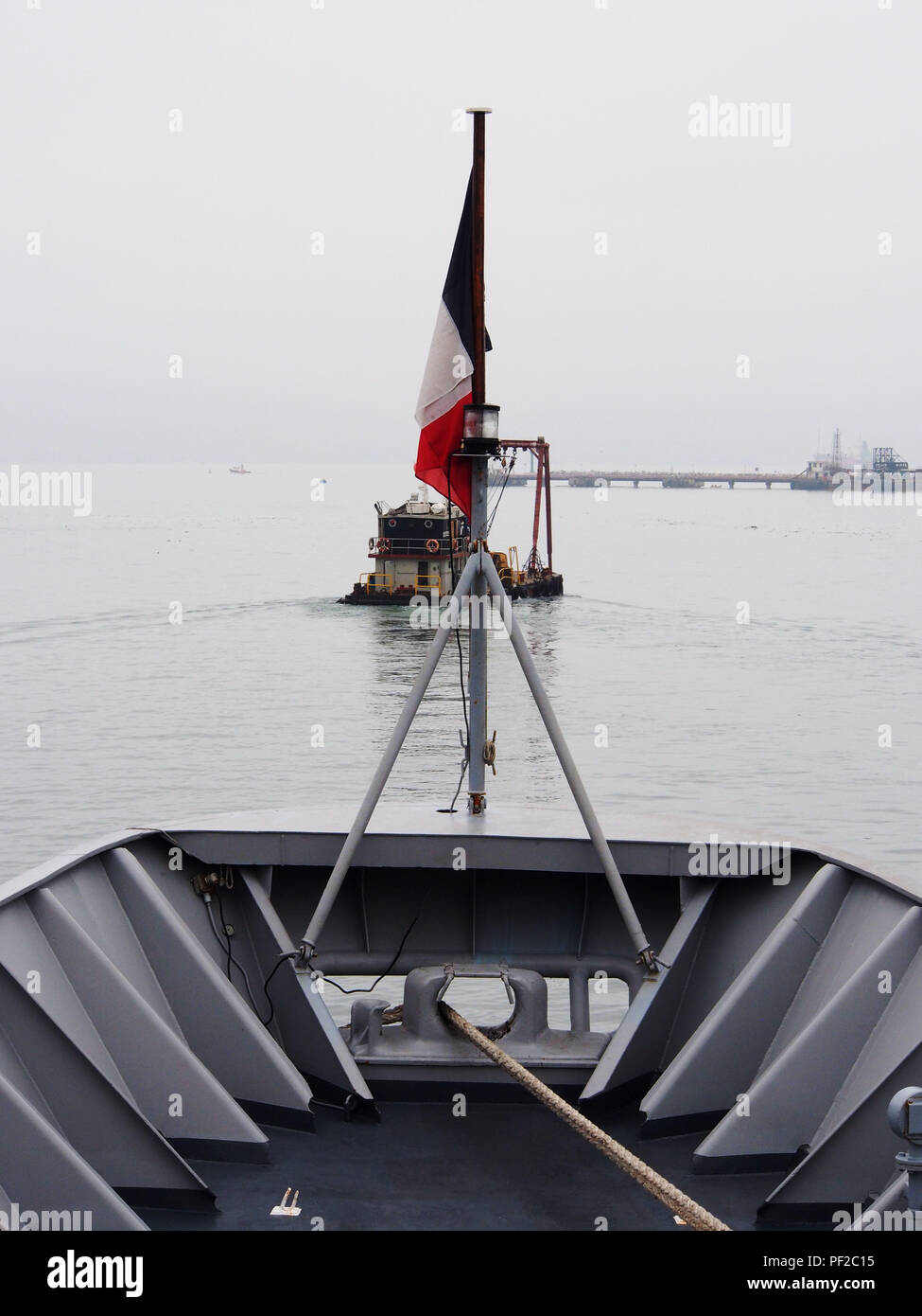 Bow deck and french flag of the monitoring light frigate of the ...