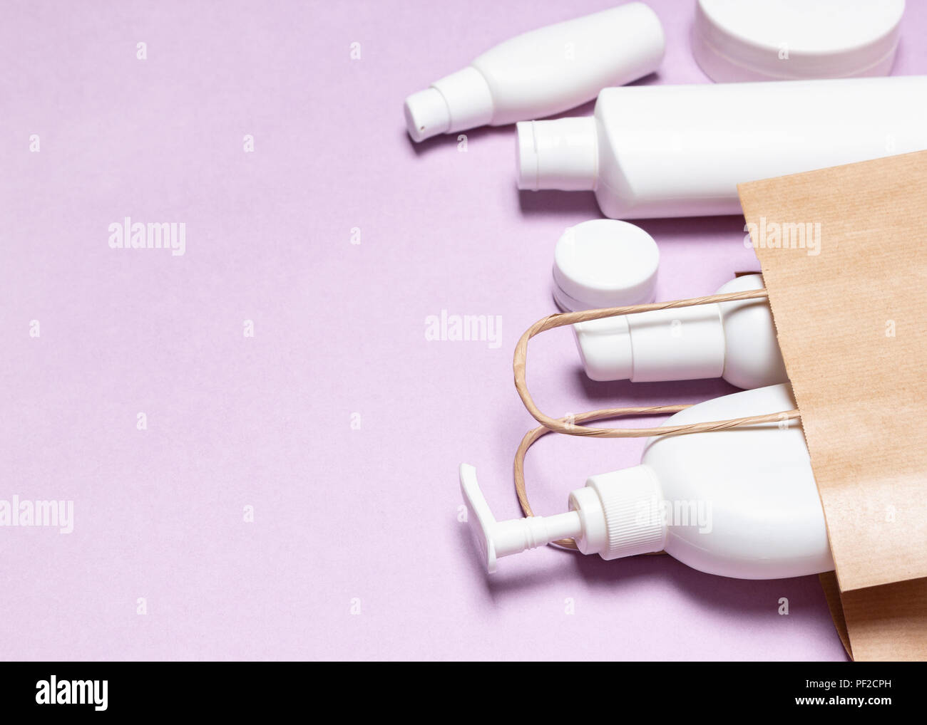 Cosmetic products with paper packaging bag. Beauty shopping concept ...
