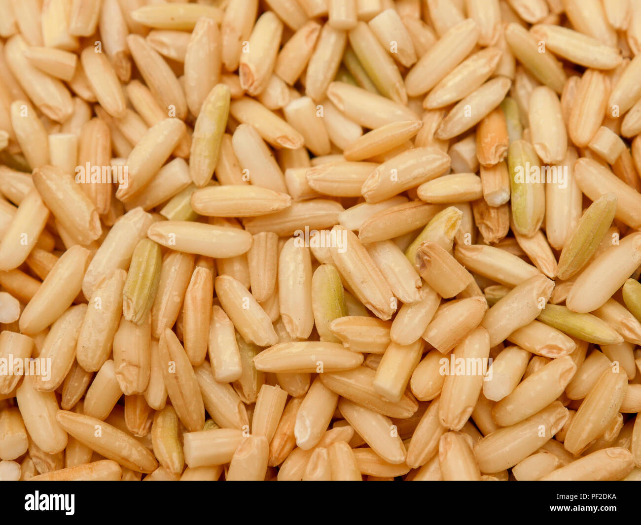 Raw brown rice. top view food background texture Stock Photo - Alamy