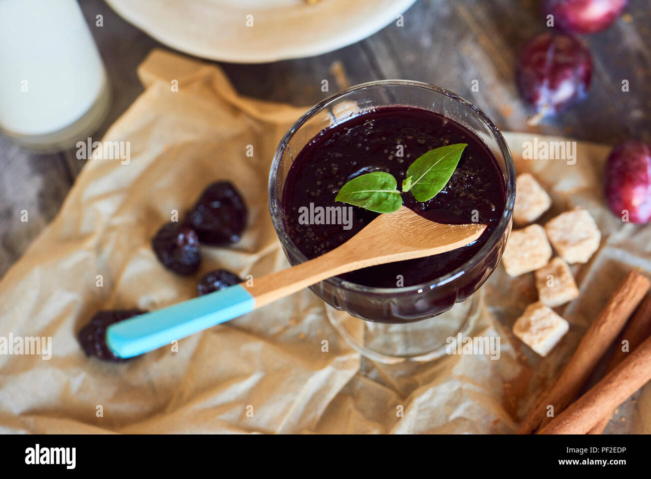 plum jam with spoon and fresh fruits Stock Photo - Alamy
