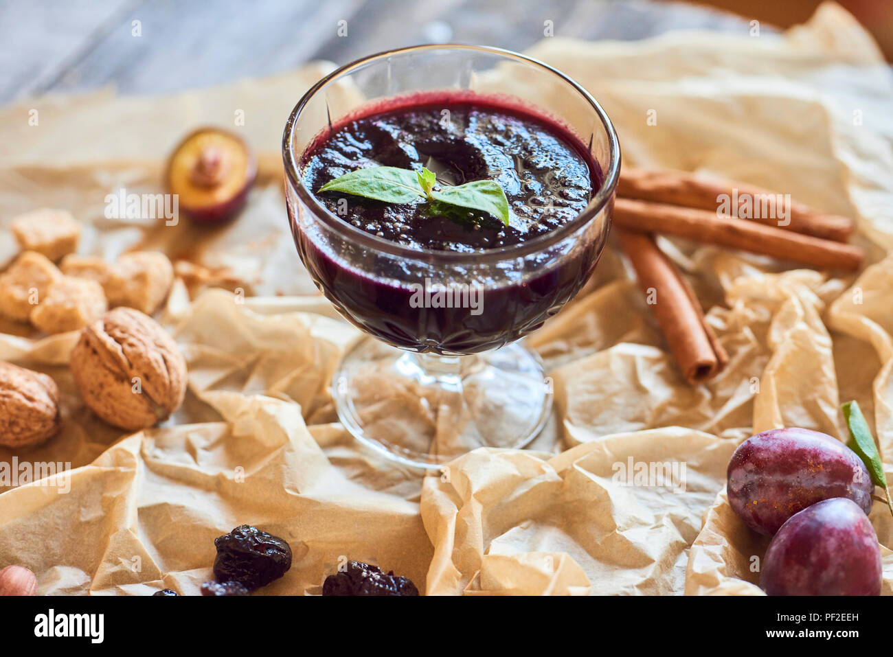 plum jam with cinnamon, fresh fruits, nuts and cane sugar Stock Photo ...