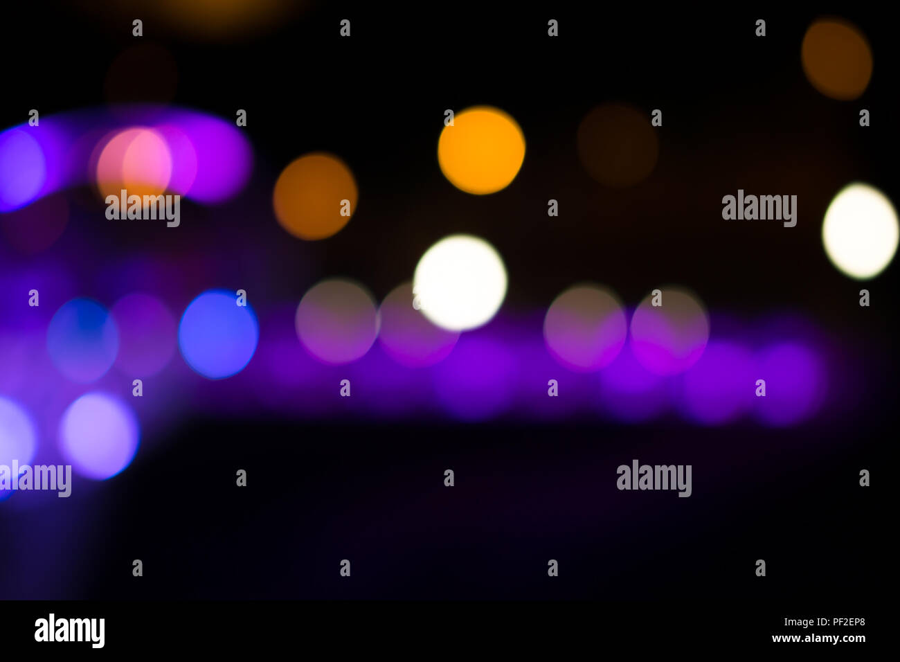 Abstract city street light defocused at night, blur bokeh, colorful & dark background Stock ...