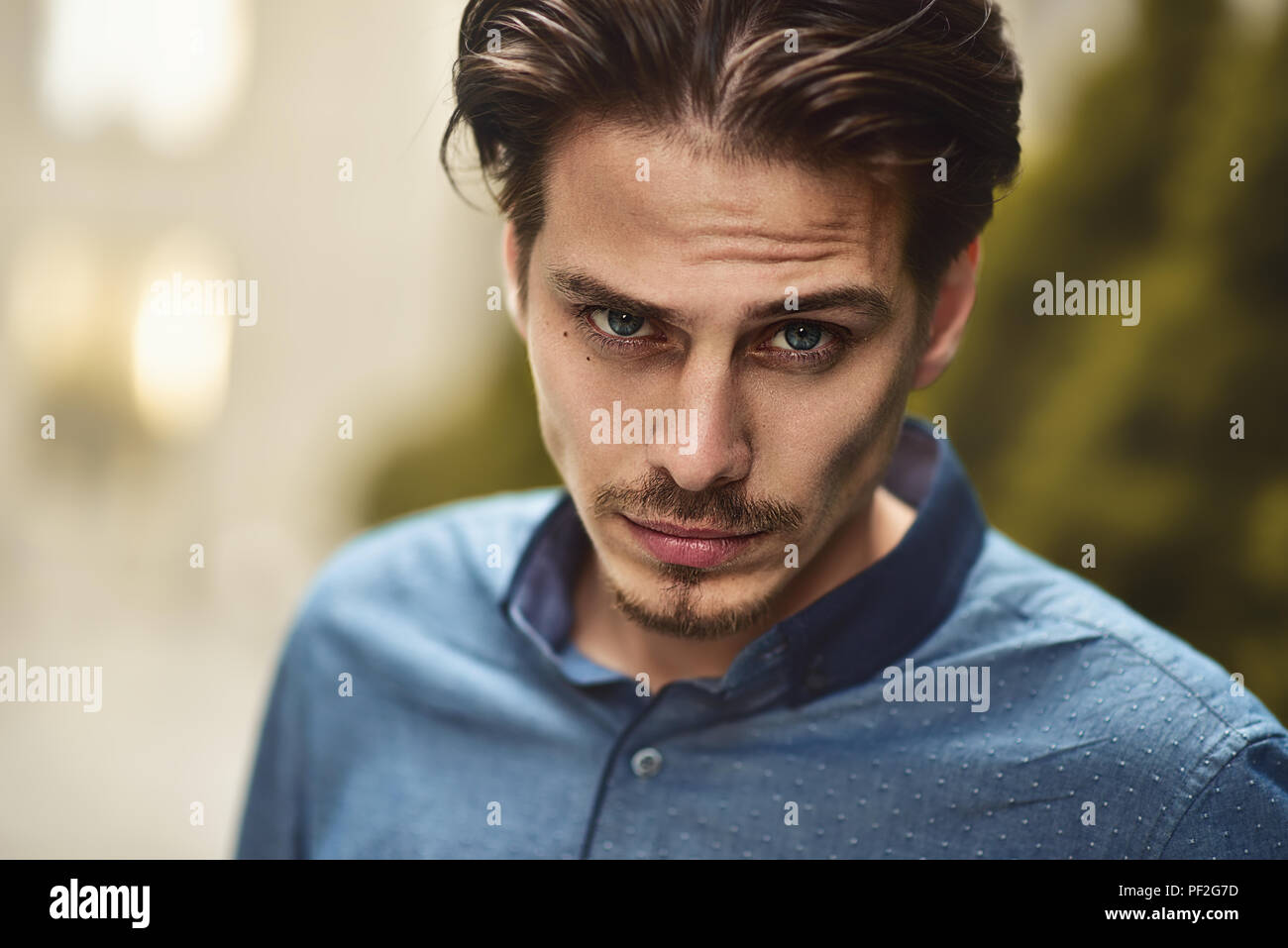 Portrait of stylish guy looking at camera Stock Photo - Alamy