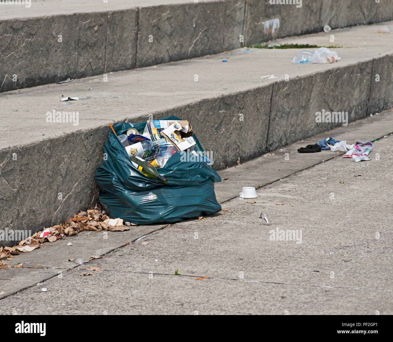 Waste management concept. Coastal pollution. Garbage on concrete ...