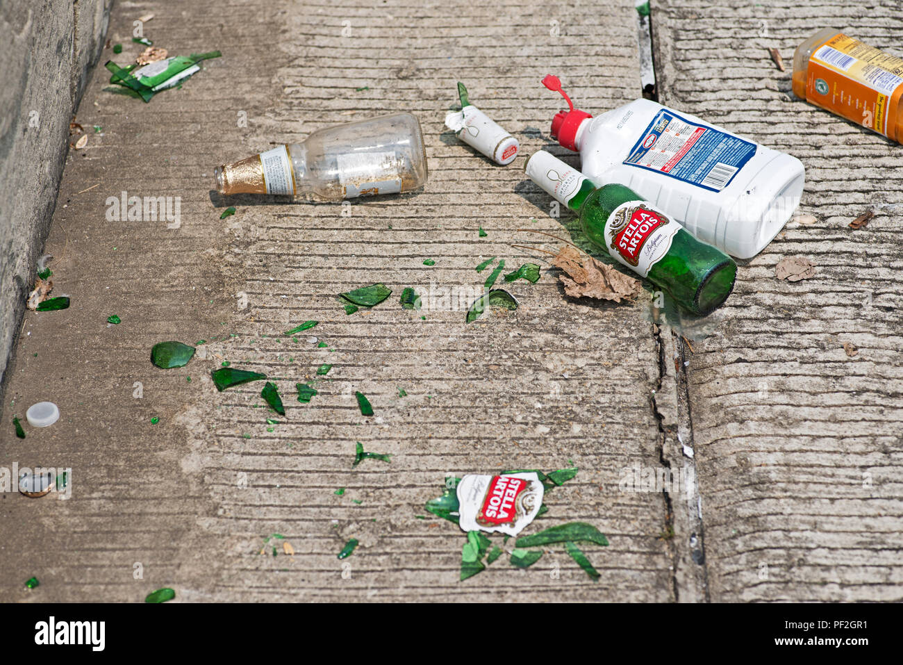 Waste management concept. Coastal pollution. Garbage on concrete ...