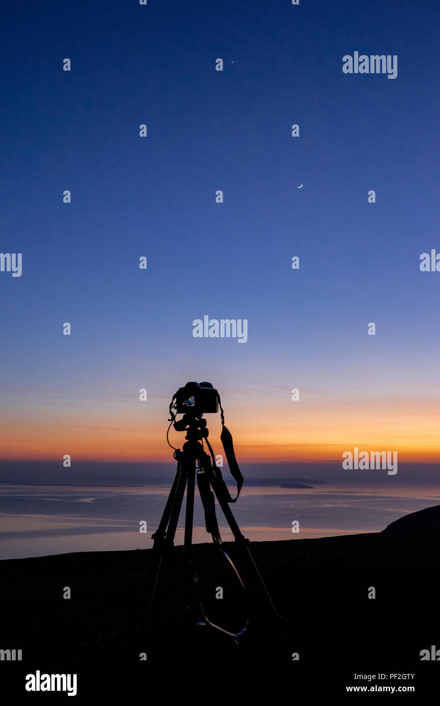 Camera on a tripod photographing the moon and Venus Stock Photo - Alamy