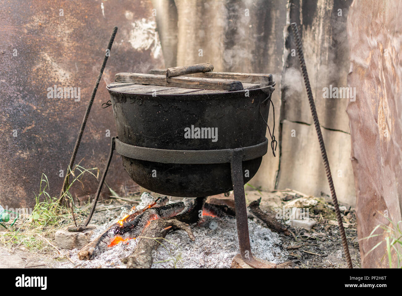 Kitchen outdoors, cooking at the stake, metal cauldron on the fire ...