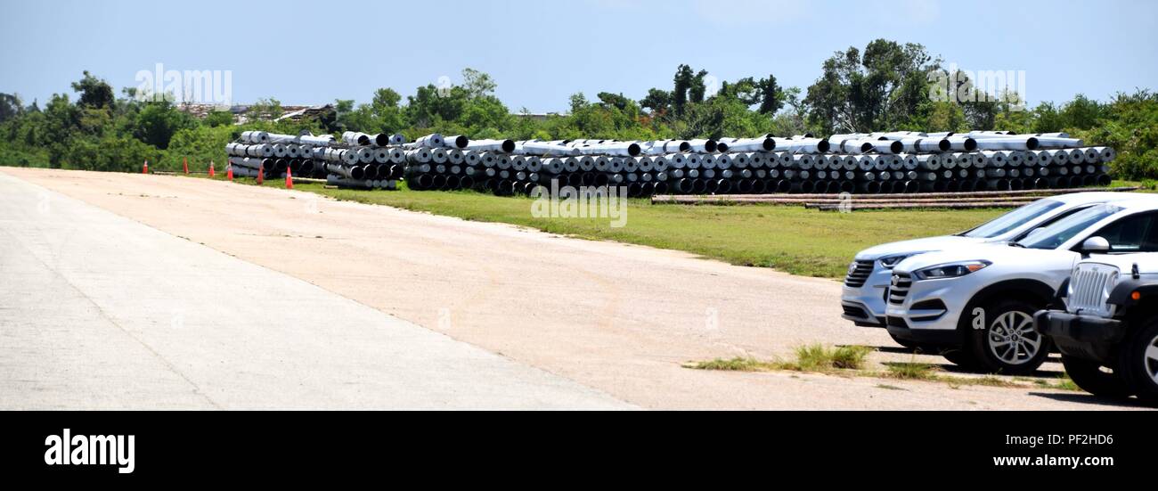 A pile of poles at the laydown yard in Aguadilla, Puerto Rico, where ...