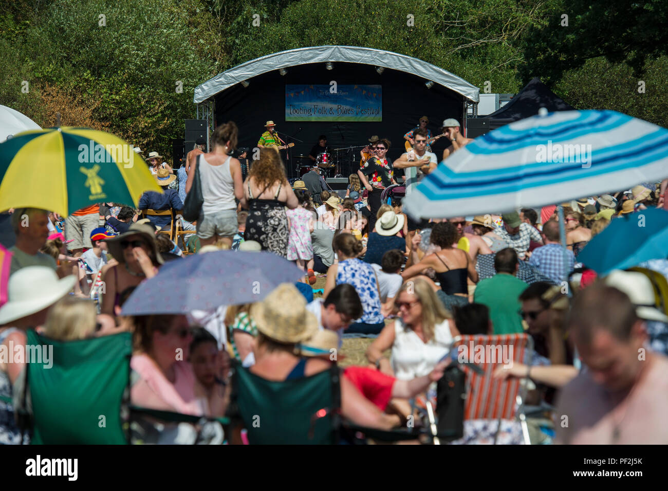 Crowds enjoying an open air music festival on a hot day in London Stock ...