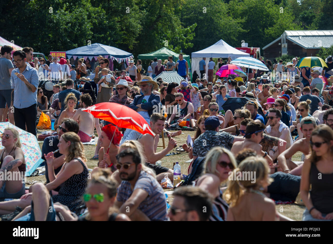 Crowds enjoying an open air music festival on a hot day in London Stock ...
