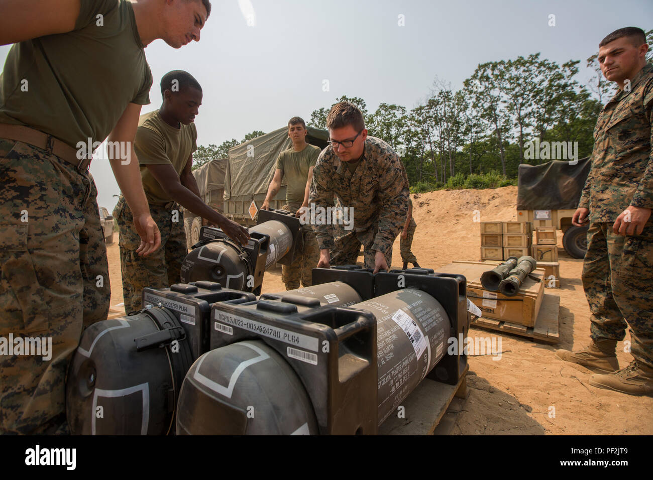 Marines with 3rd Battalion, 25th Marine Regiment, off-load six FGM-148 ...