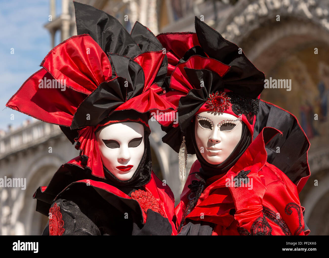 Revellers In Traditional Elaborate Mask And Costume At Venice Carnival ...