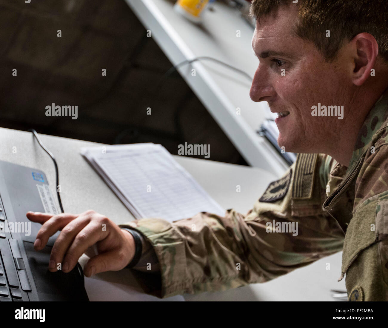 Sgt. Dale Tupling of the 141st Trailer Transfer Point reads information ...