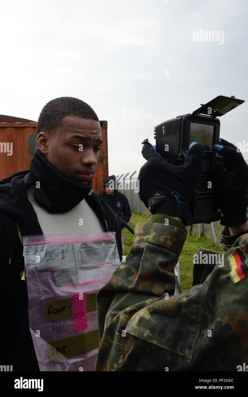 A German Kampfschwimmer, Navy commando combat swimmer, photographs the ...
