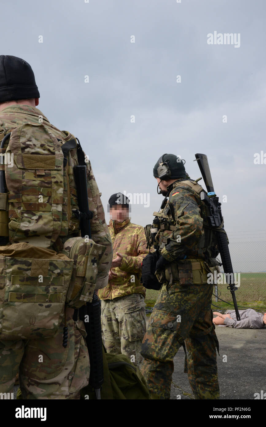 A German Kampfschwimmer, Navy commando combat swimmer, receives the ...