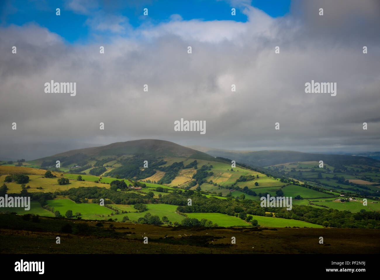 The rain clouds coming over the mountains at the Welsh Countryside in ...