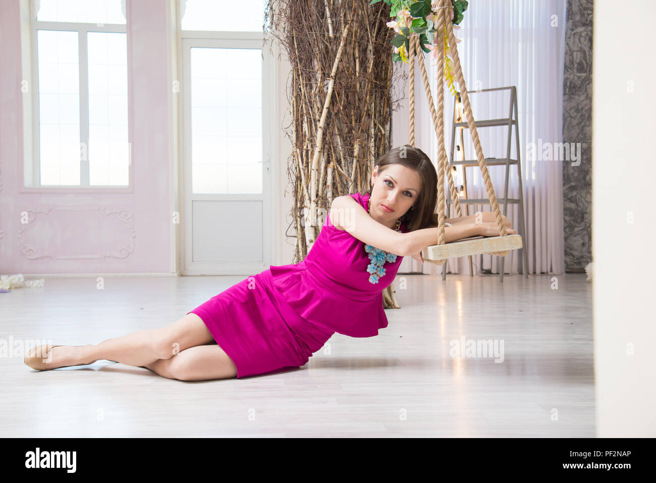 pretty girl at a photo shoot in the studio Stock Photo - Alamy