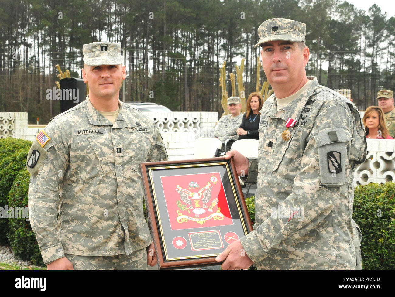 Capt. Martin Mitchell presents Lt. Col. Michael Hunter, the outgoing ...