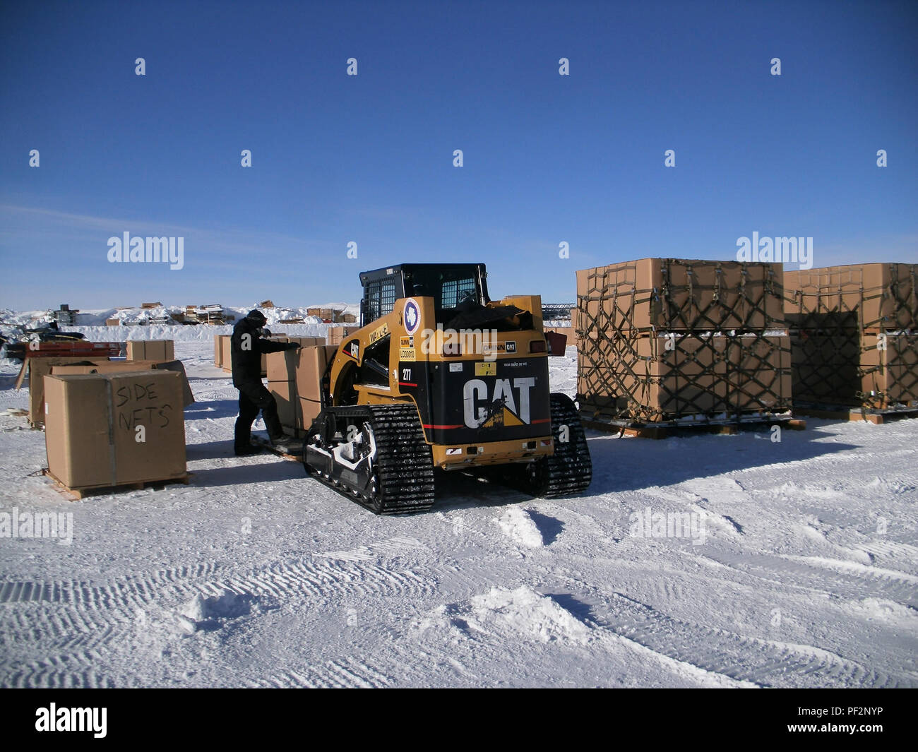 Pallets of excess and obsolete materials are placed in position outside ...