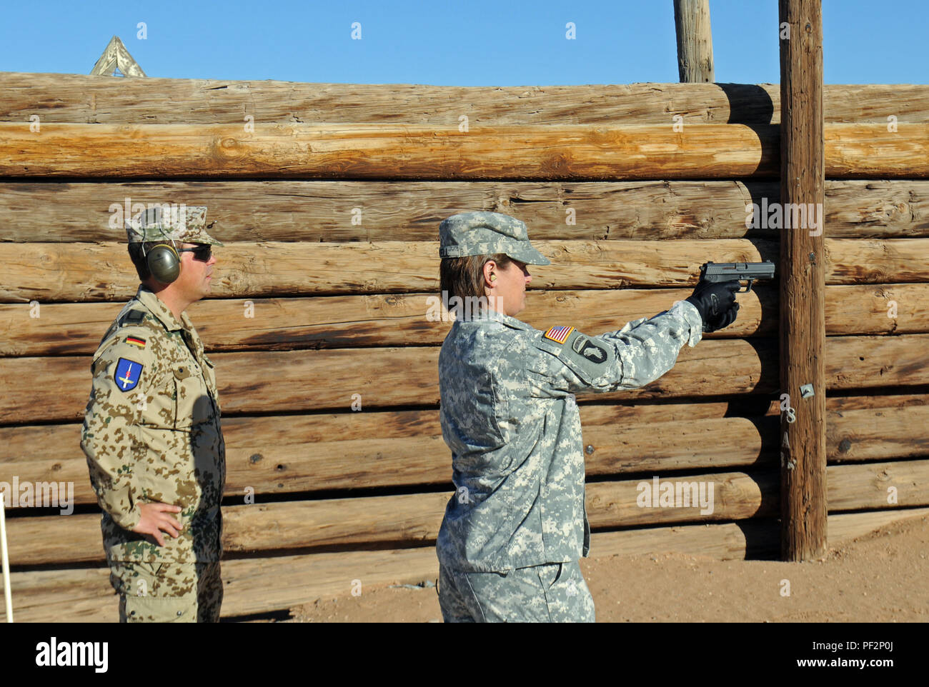 FORT BLISS, TEXAS – Sgt. Sarah Powell, fires a Heckler & Koch P8 pistol ...
