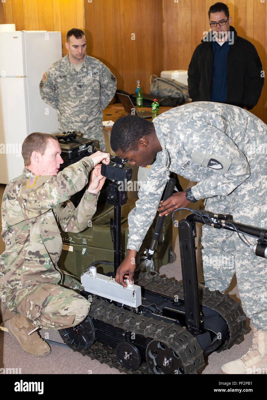 Trainers from the Maneuver Support Center of Excellence (background ...