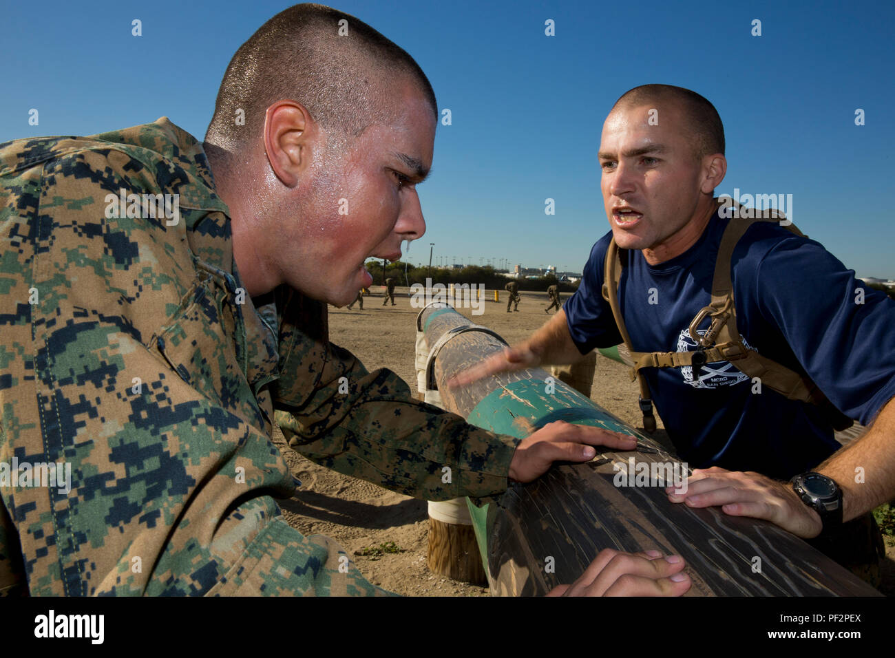 U.S. Marine Corps Staff Sgt. Jevon McKinnon, right, a drill instructor ...