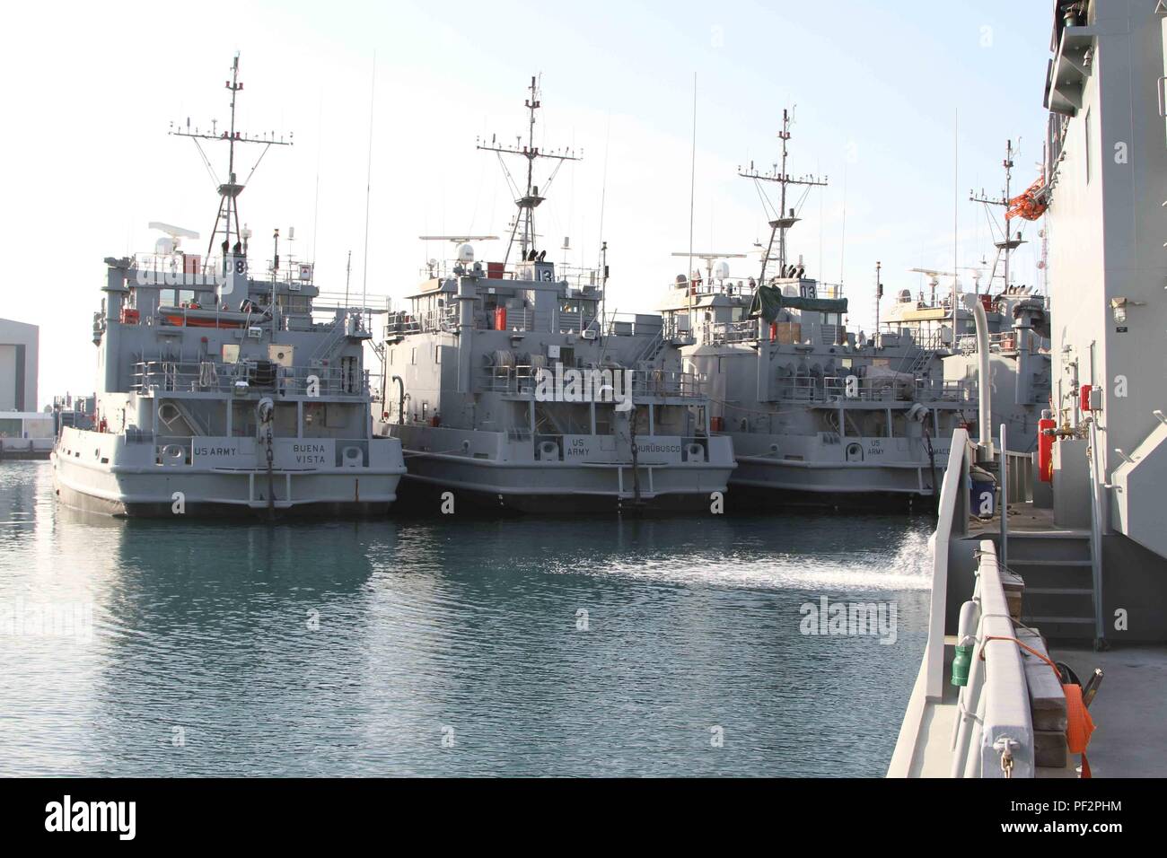 Landing Craft Utility boats sit in dock at the Kuwait Naval Base as ...