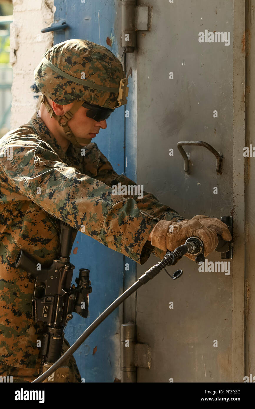 U.S. Marine Corps Cpl. Eric A. Moore, an infantry assault man with ...