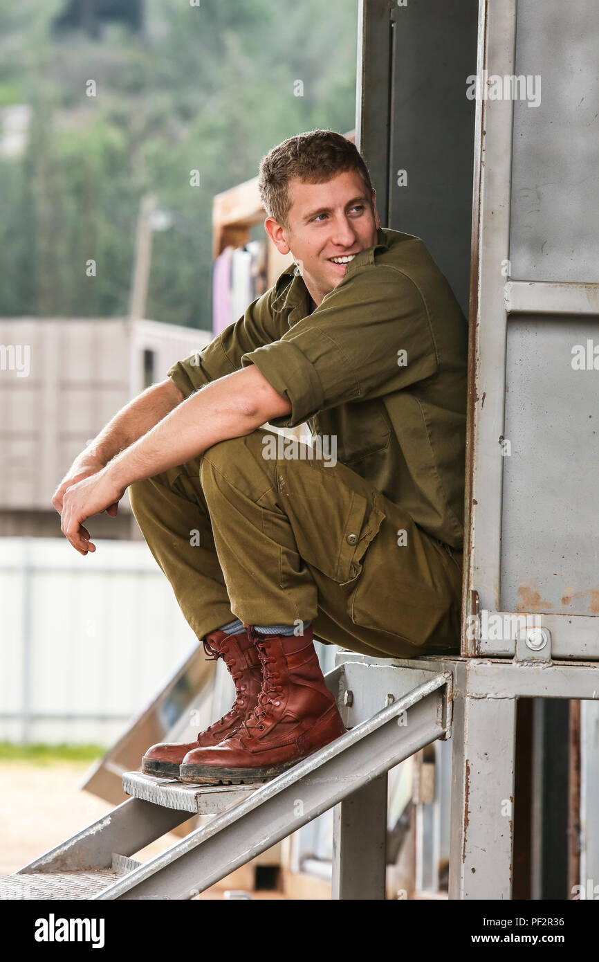 An Israel Defense Force soldier smiles after spending the day teaching ...