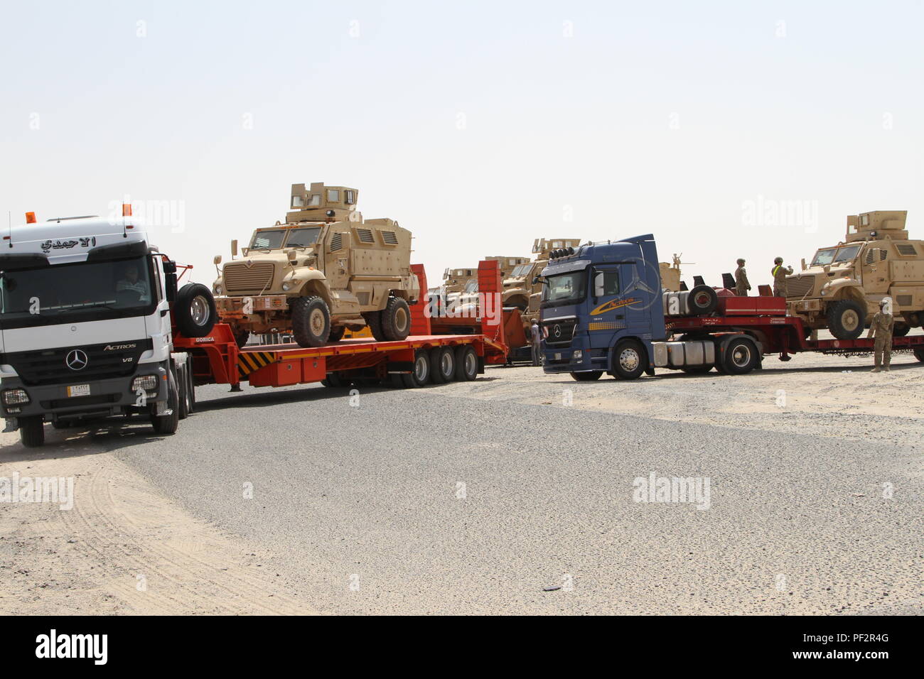 K-Crossing, Kuwait – Iraqi trucks line up as US Soldiers load Caiman ...