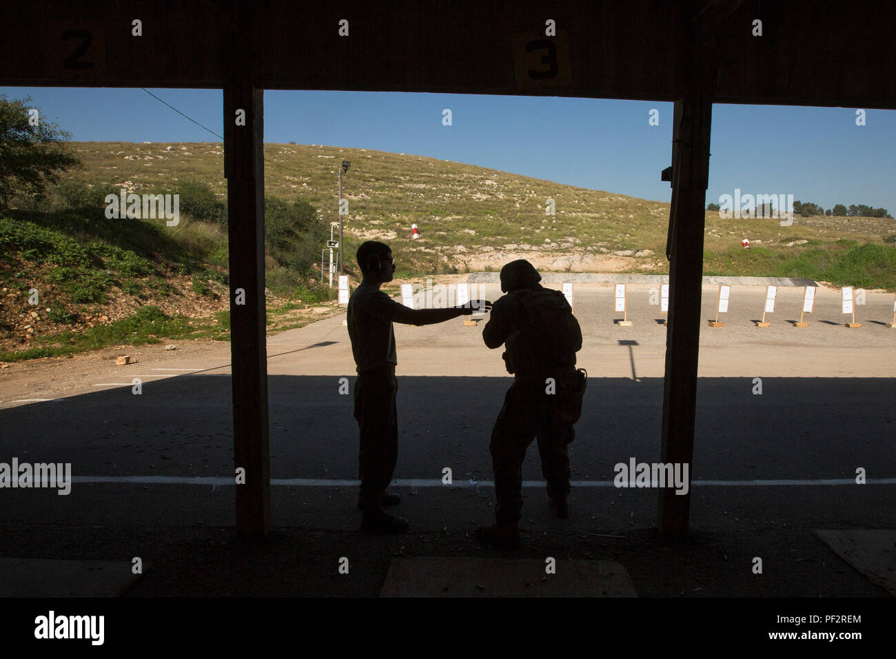 An Israel Defense Force soldier taps the shoulder of a U.S. Marine with ...