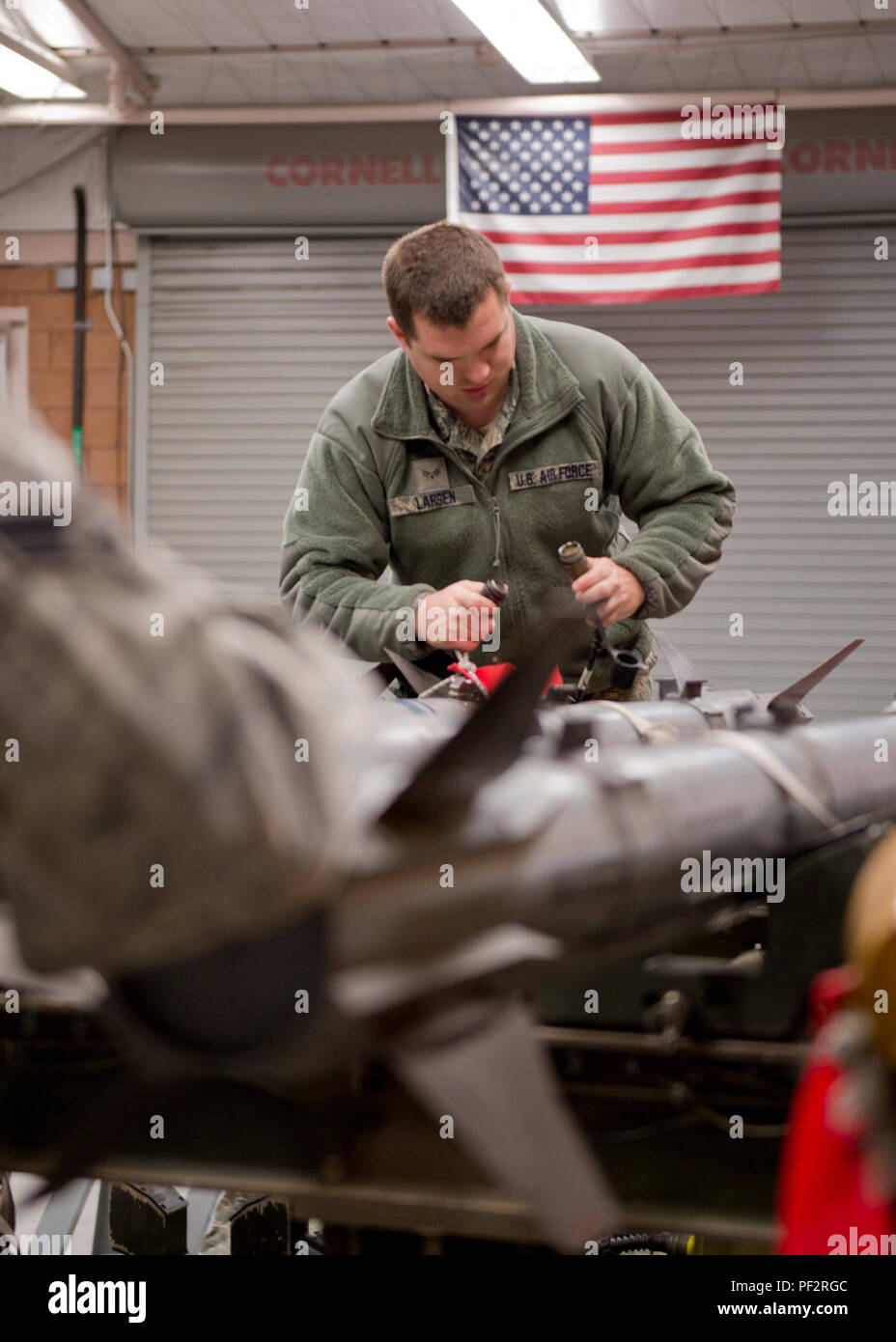 Senior Airman Ian Larson, a munitions systems worker from the 124th ...